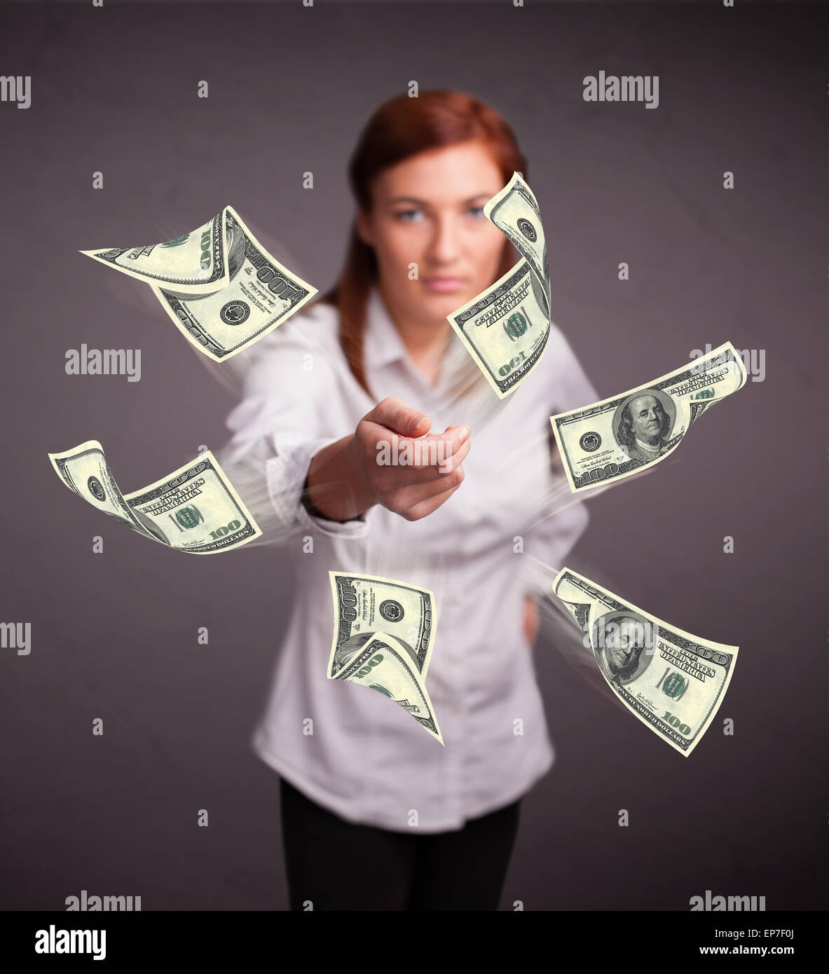 Young girl throwing money Stock Photo - Alamy