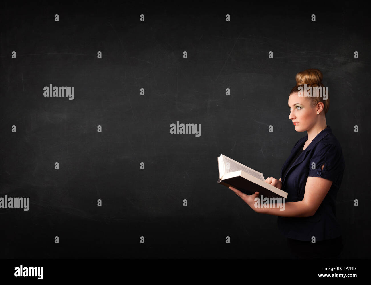 Young lady reading a book Stock Photo - Alamy