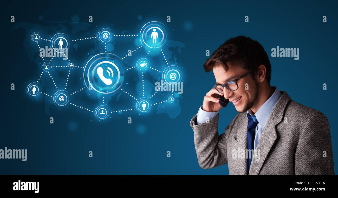 Young boy making phone call with social network icons Stock Photo - Alamy