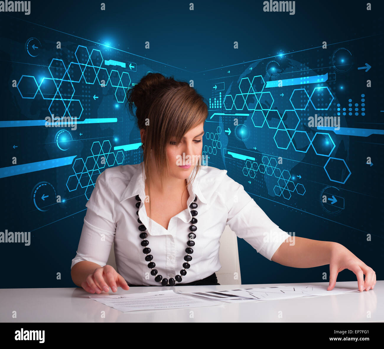Businesswoman doing paperwork with futuristic background Stock Photo ...