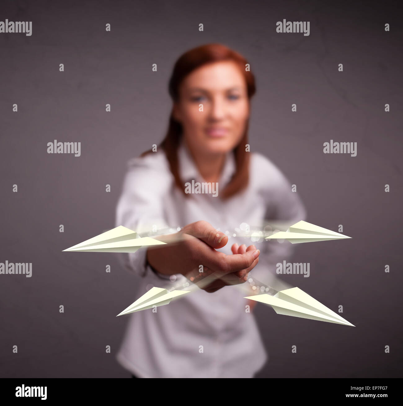 Beautiful lady throwing origami airplanes Stock Photo - Alamy