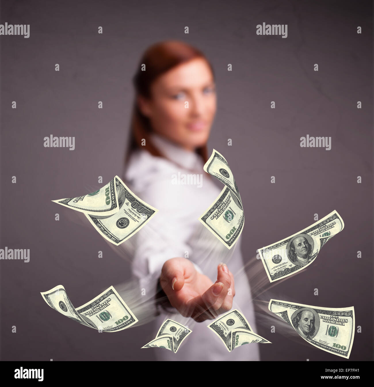 Young girl throwing money Stock Photo - Alamy