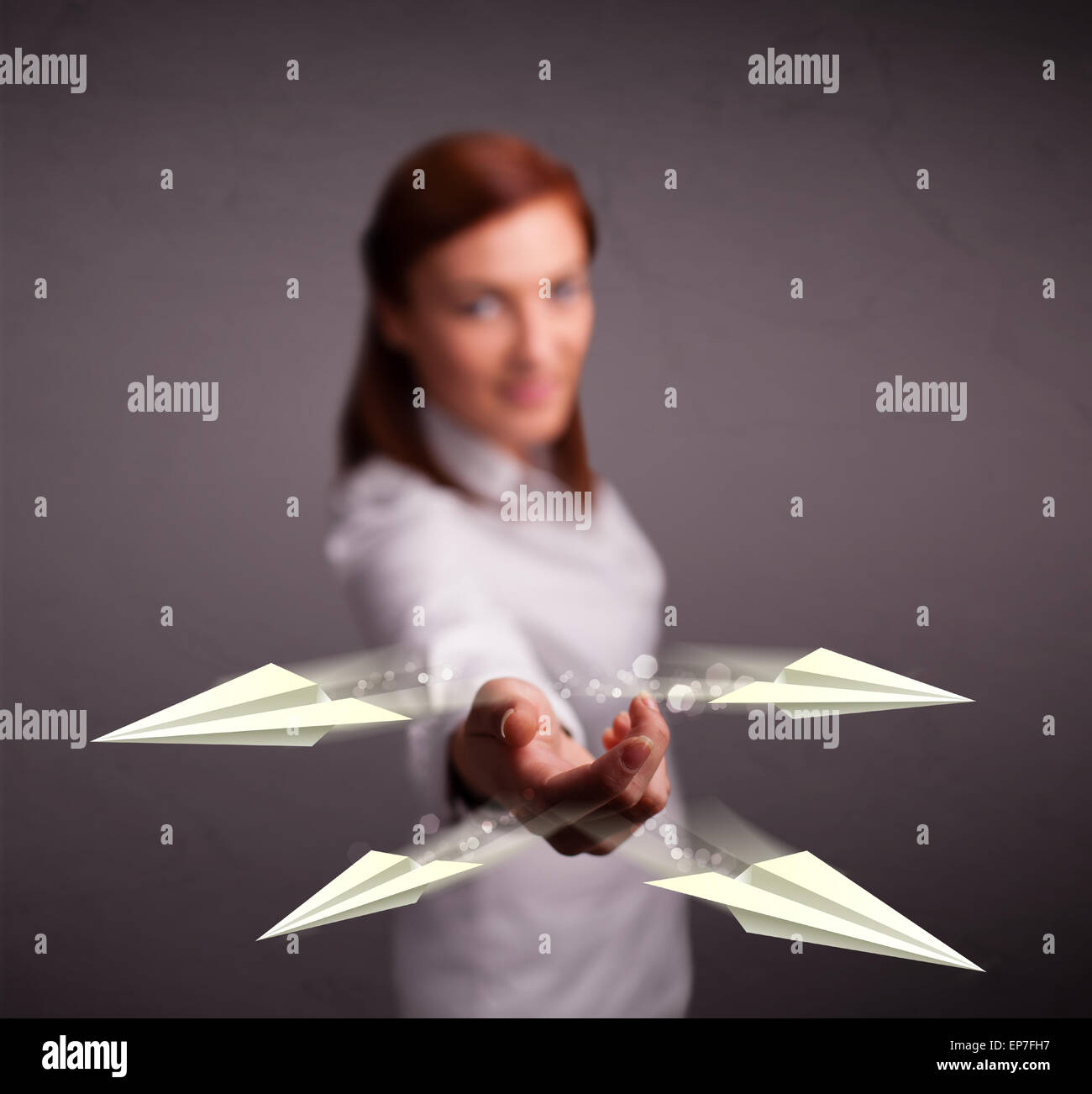 Beautiful lady throwing origami airplanes Stock Photo - Alamy