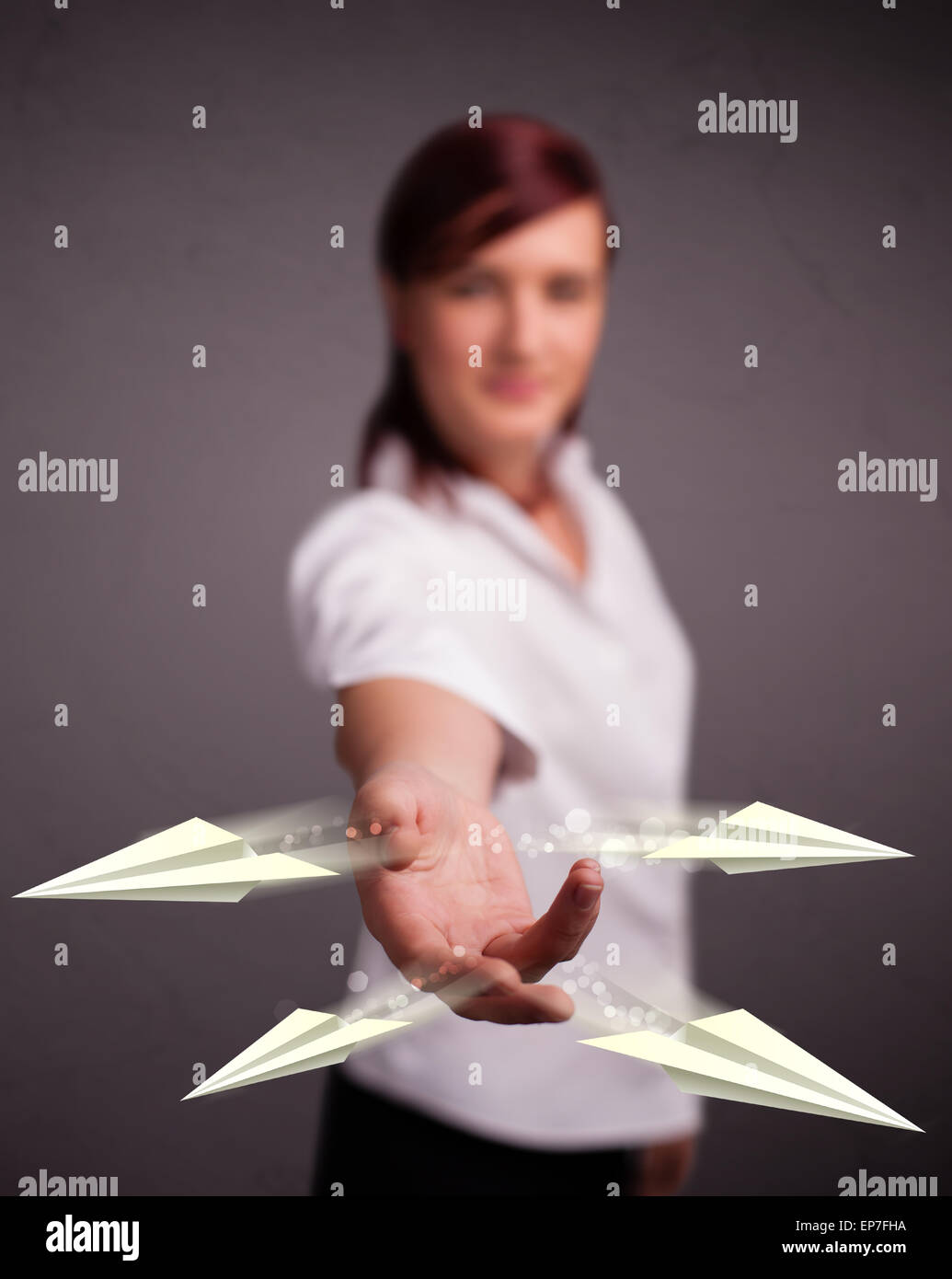 Beautiful lady throwing origami airplanes Stock Photo - Alamy