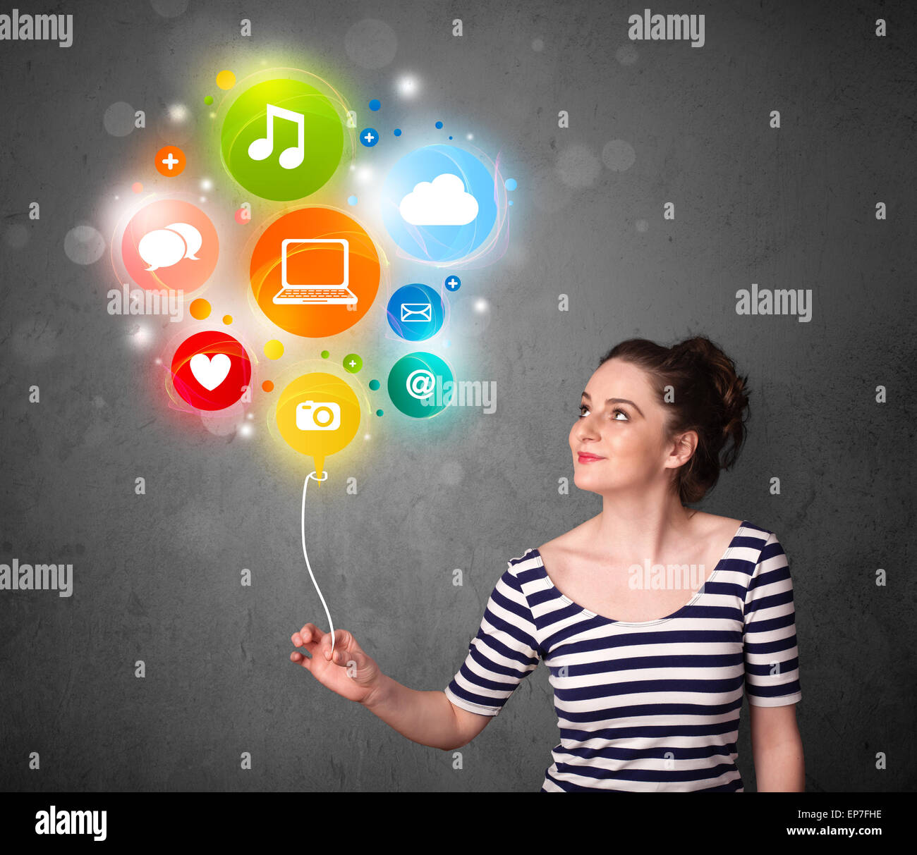Woman holding social media balloon Stock Photo - Alamy