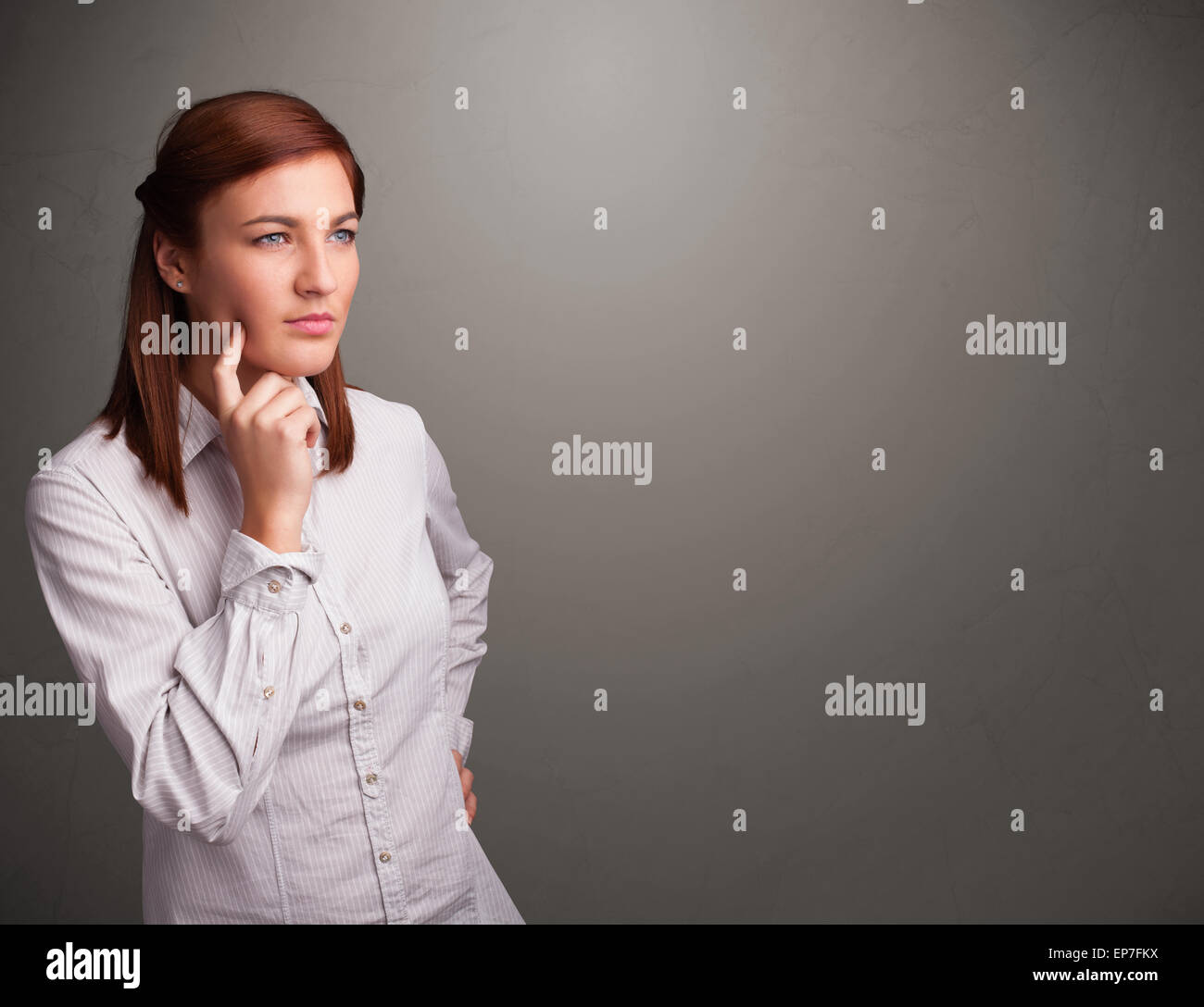 Beautiful woman thinking with empty copy space Stock Photo - Alamy