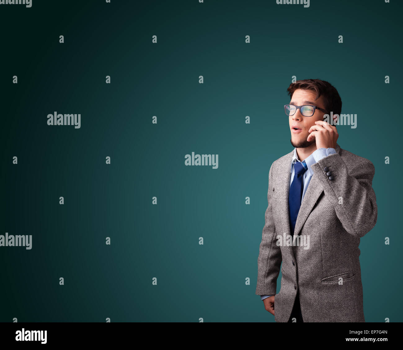 Young man making phone call with copy space Stock Photo - Alamy