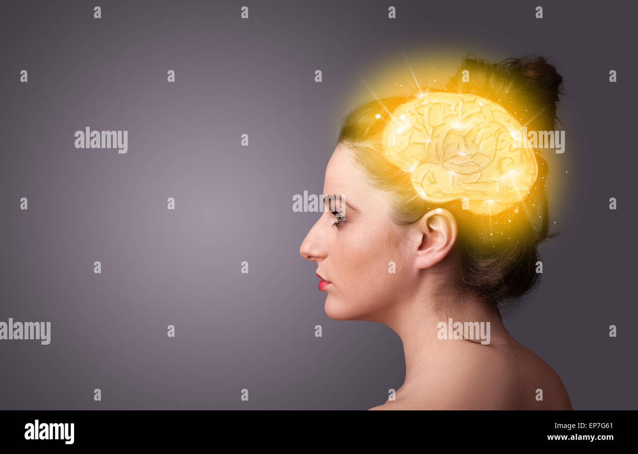 Young girl thinking with glowing brain illustration Stock Photo - Alamy