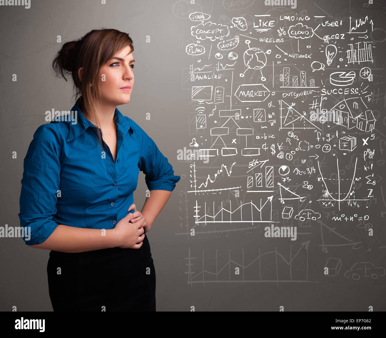Pretty woman looking at stock market graphs and symbols Stock Photo - Alamy