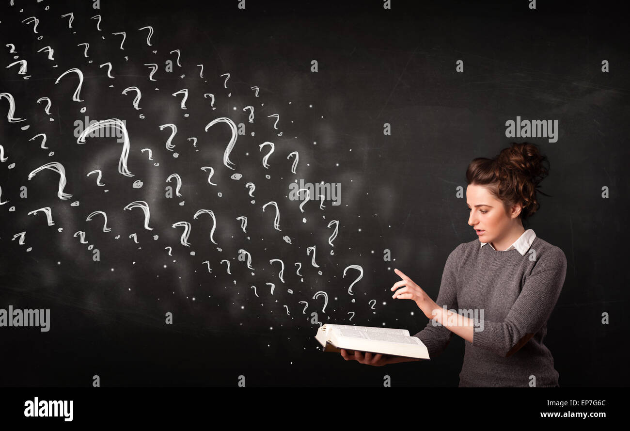 Pretty woman reading a book with question marks coming out from it ...