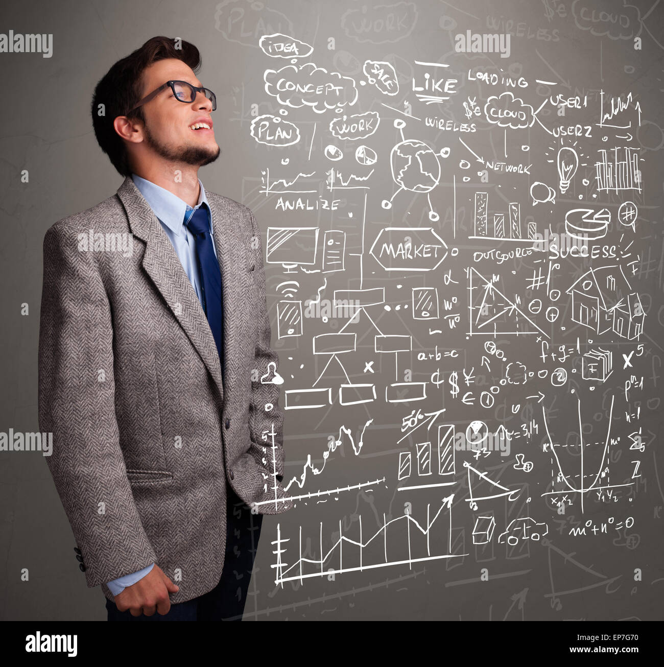 Attractive man looking at stock market graphs and symbols Stock Photo ...