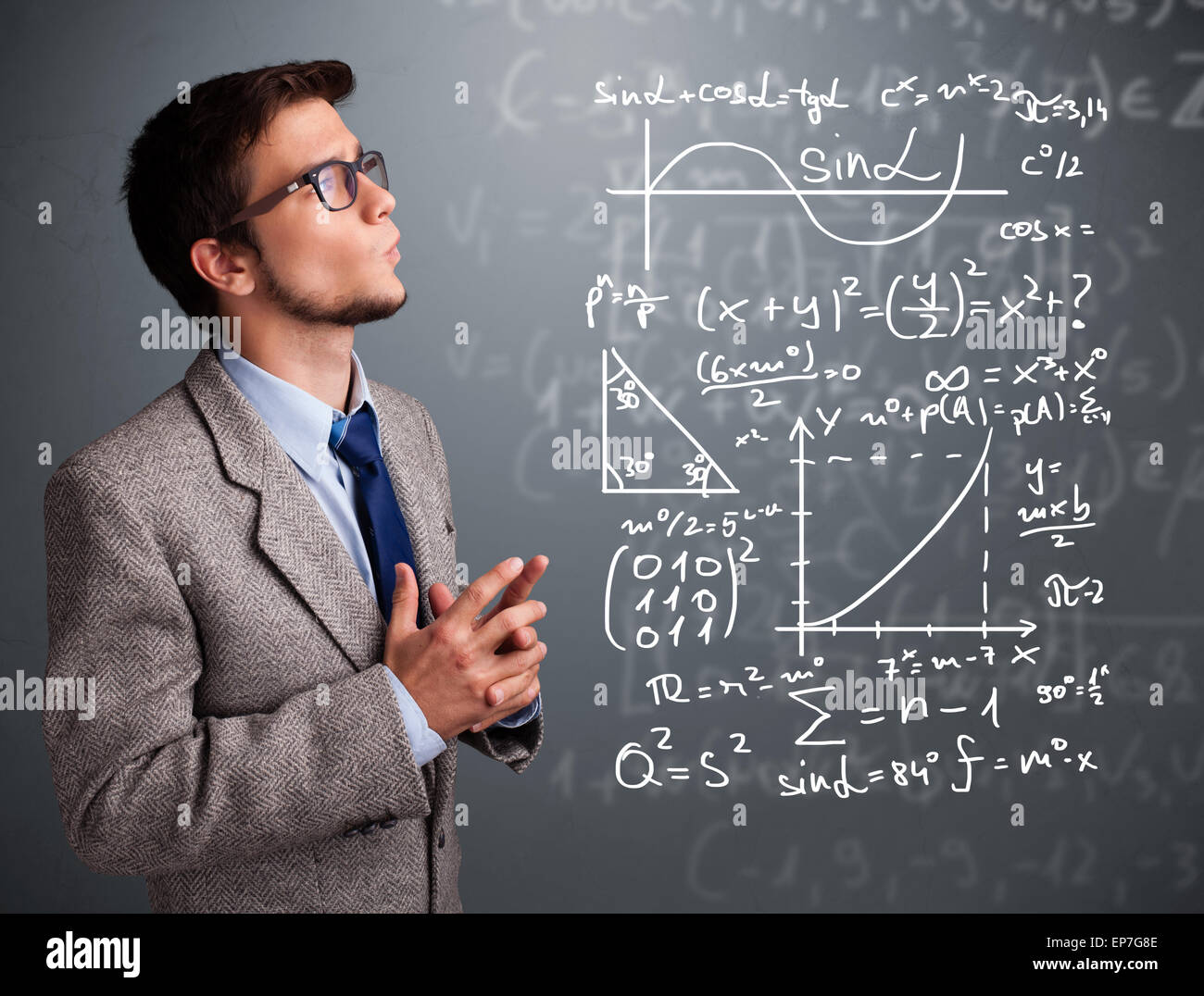 Handsome school boy thinking about complex mathematical signs Stock ...