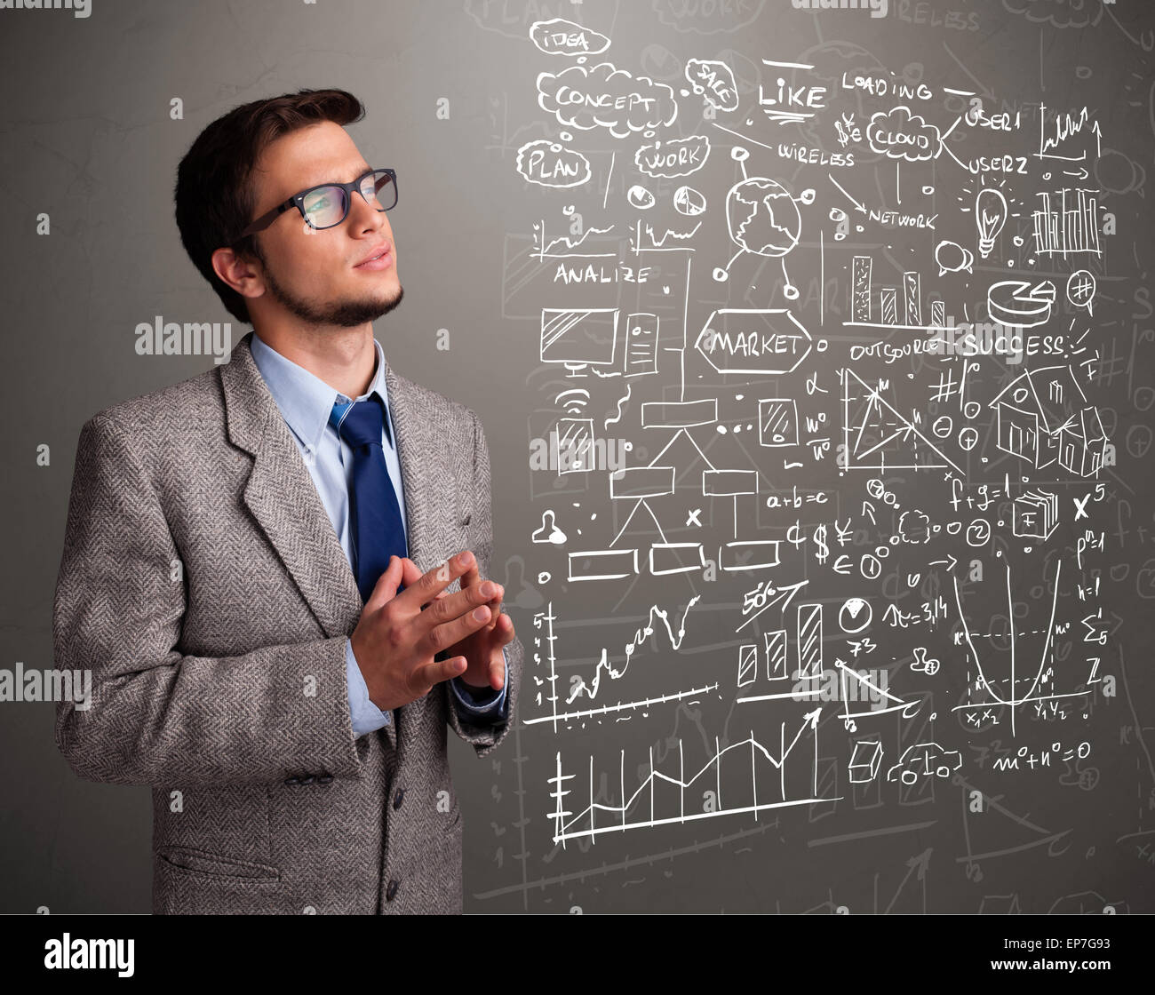 Attractive man looking at stock market graphs and symbols Stock Photo ...
