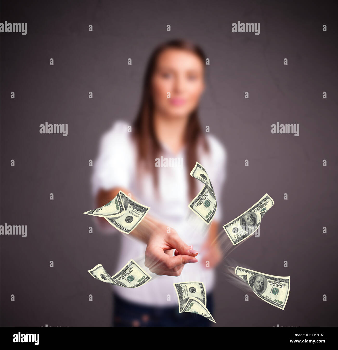 Young girl throwing money Stock Photo - Alamy