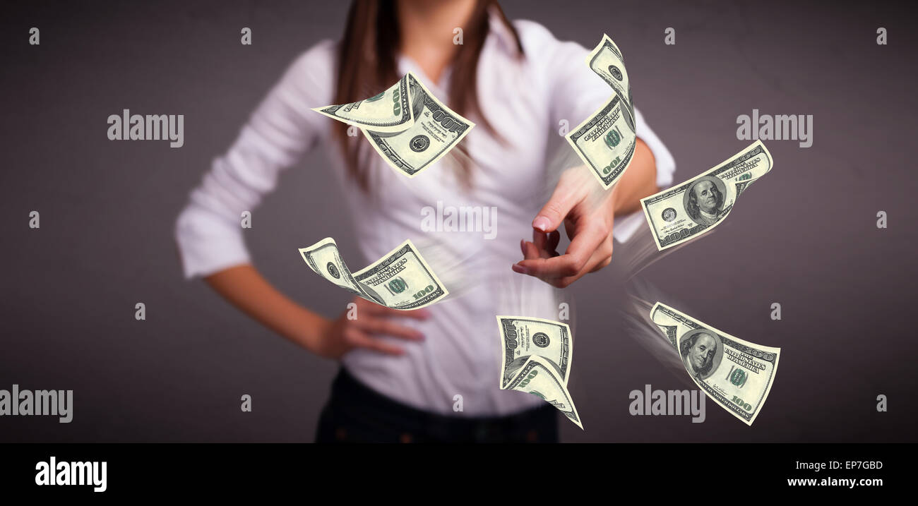 Young girl throwing money Stock Photo - Alamy