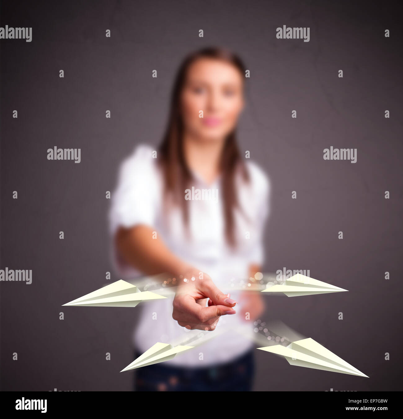 Beautiful lady throwing origami airplanes Stock Photo - Alamy