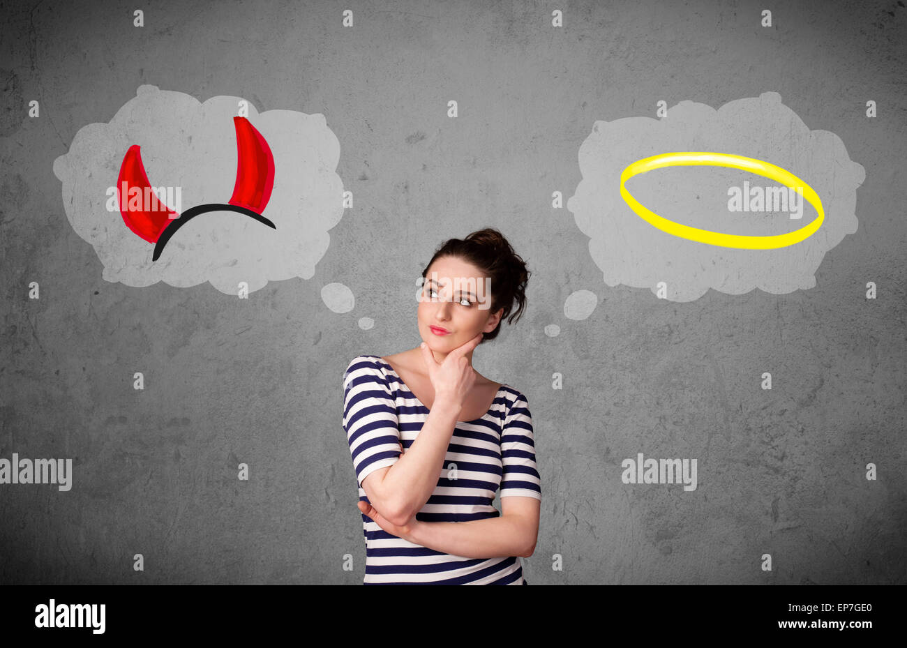 Woman choosing between good and bad Stock Photo - Alamy