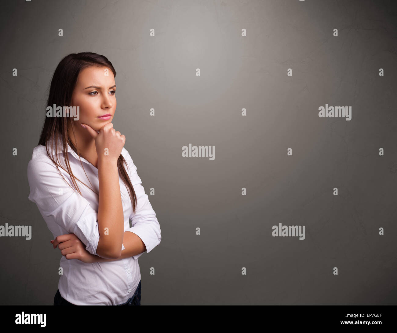 Beautiful woman thinking with empty copy space Stock Photo - Alamy