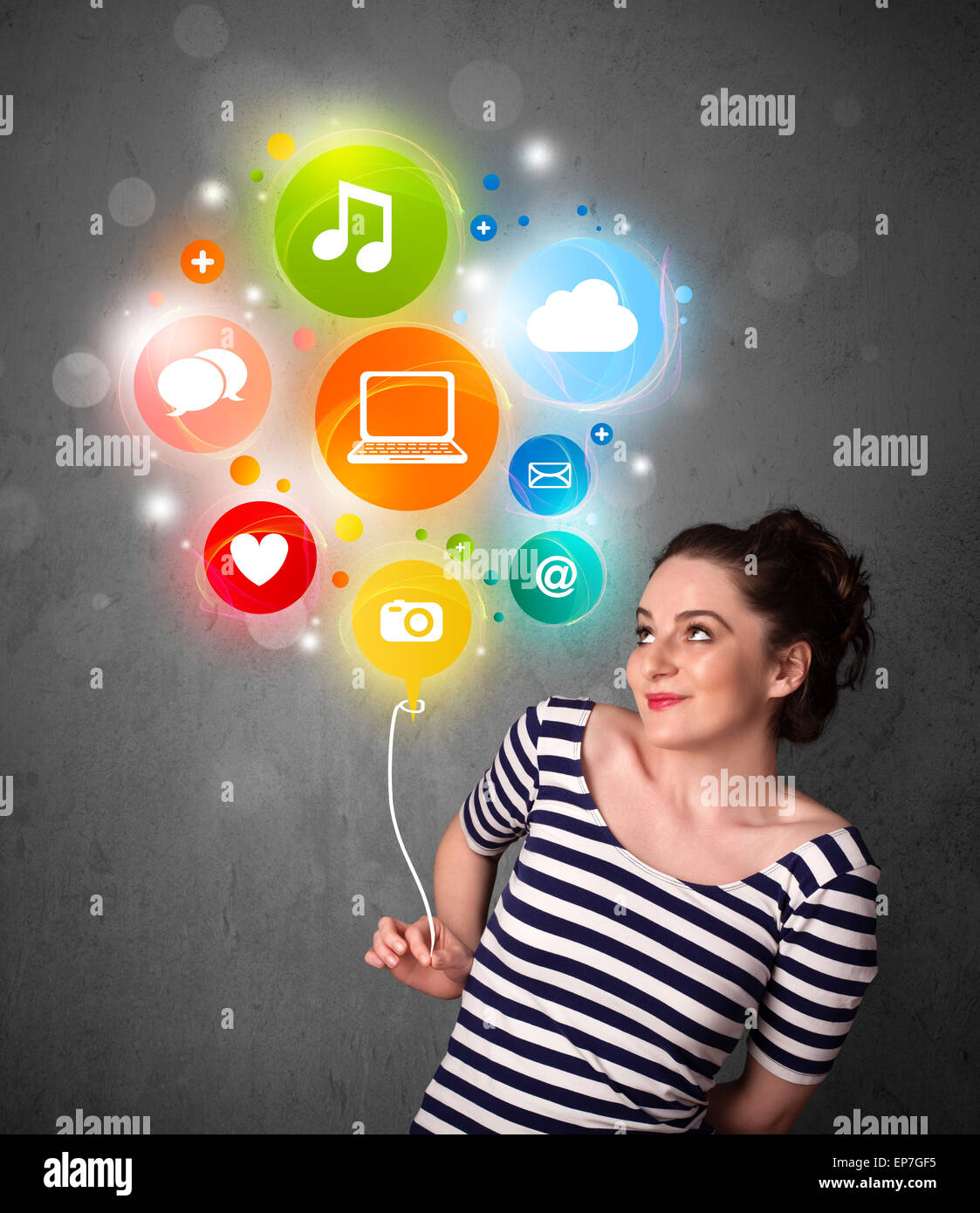 Woman holding social media balloon Stock Photo - Alamy