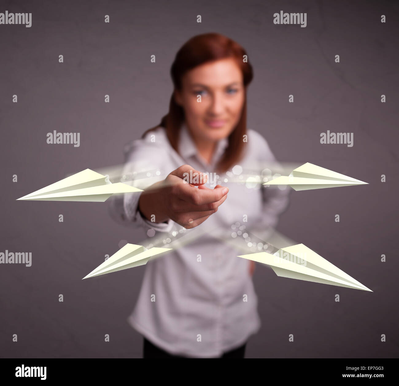 Beautiful lady throwing origami airplanes Stock Photo - Alamy
