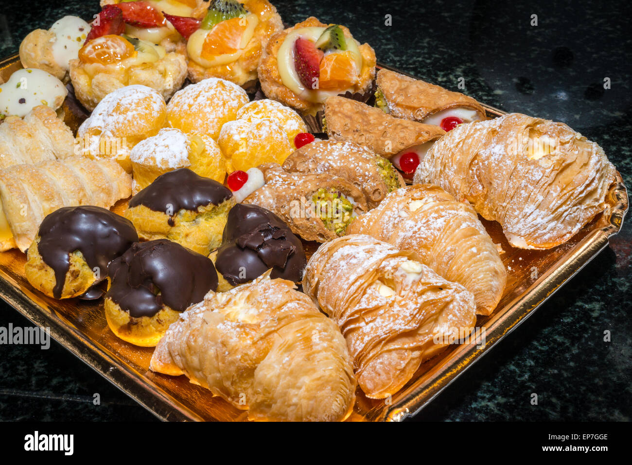 colorful pastries with fruits, cream and chocolate, the real Italian ...