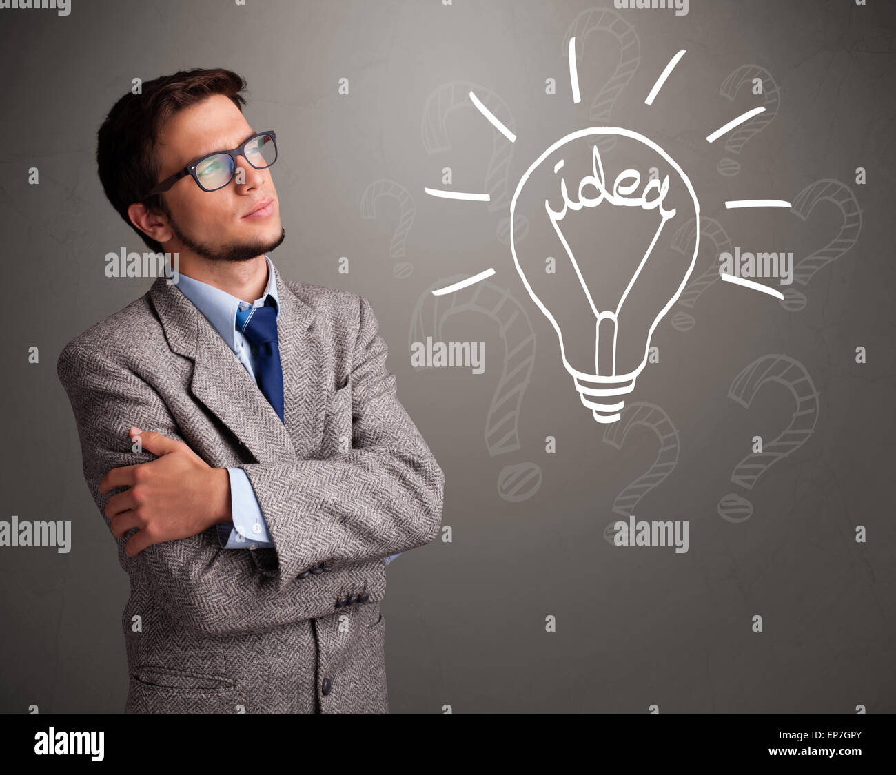 Young boy comming up with a light bulb idea sign Stock Photo - Alamy