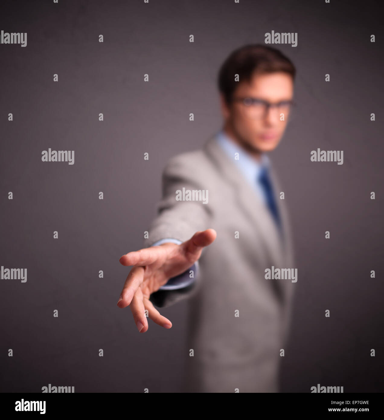 Young man standing and throwing something Stock Photo - Alamy