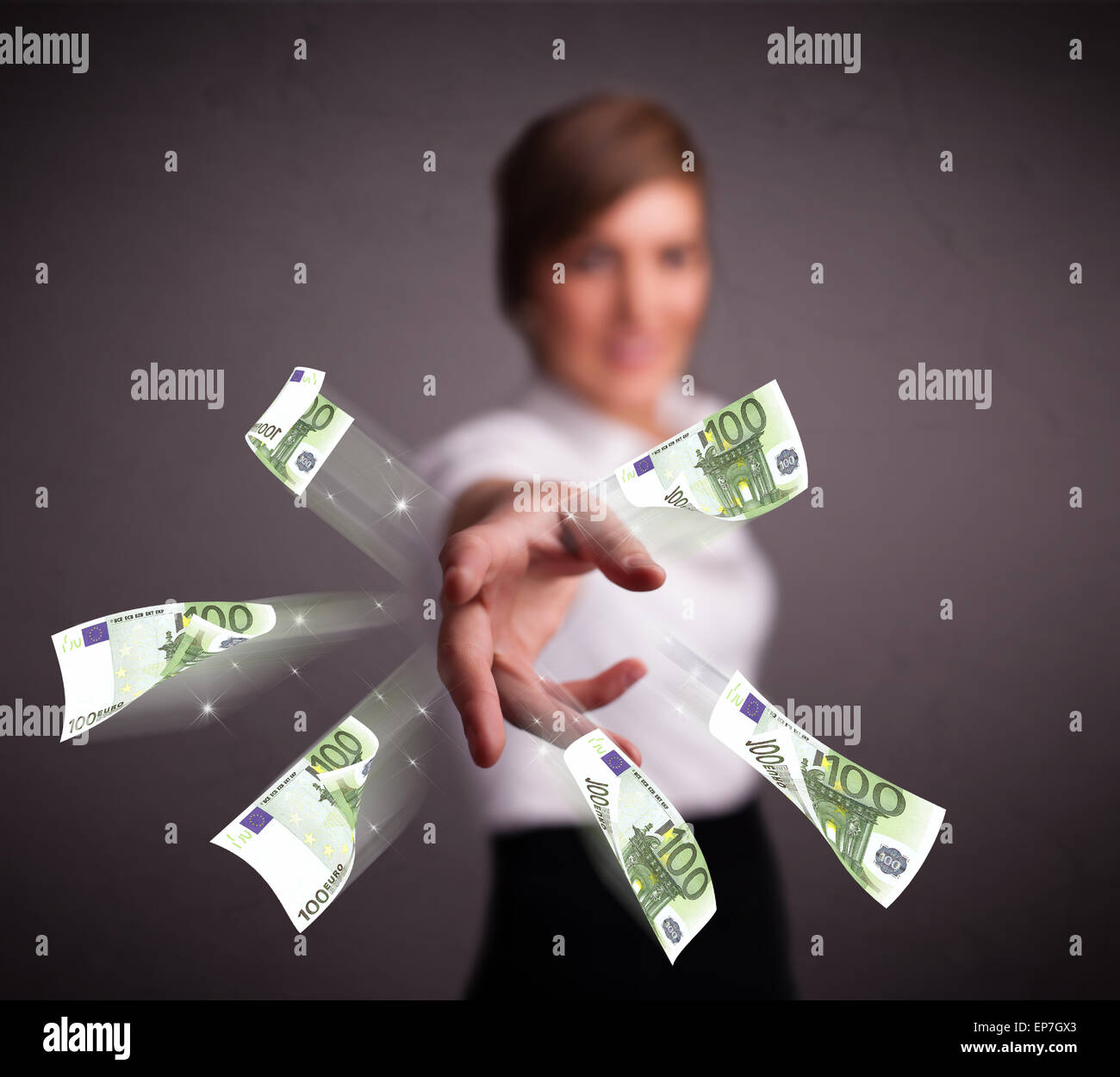 Pretty woman standing and throwing money Stock Photo - Alamy