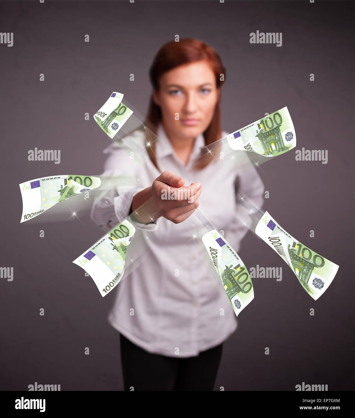 Pretty woman standing and throwing money Stock Photo - Alamy