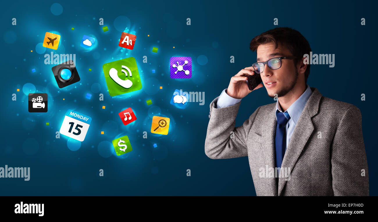 Young man calling by phone with various icons Stock Photo - Alamy