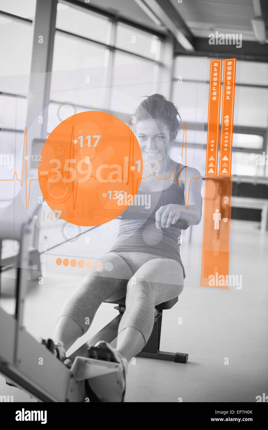 Front view of a girl on rowing machine with futuristic interface Stock ...