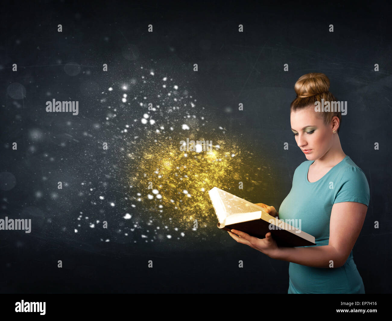 Young lady reading a magical book Stock Photo - Alamy