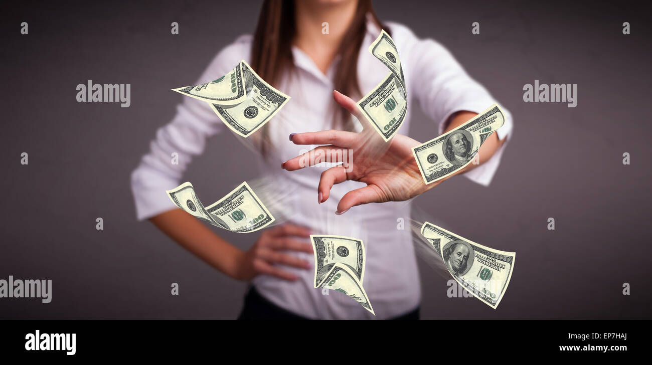 Young girl throwing money Stock Photo - Alamy