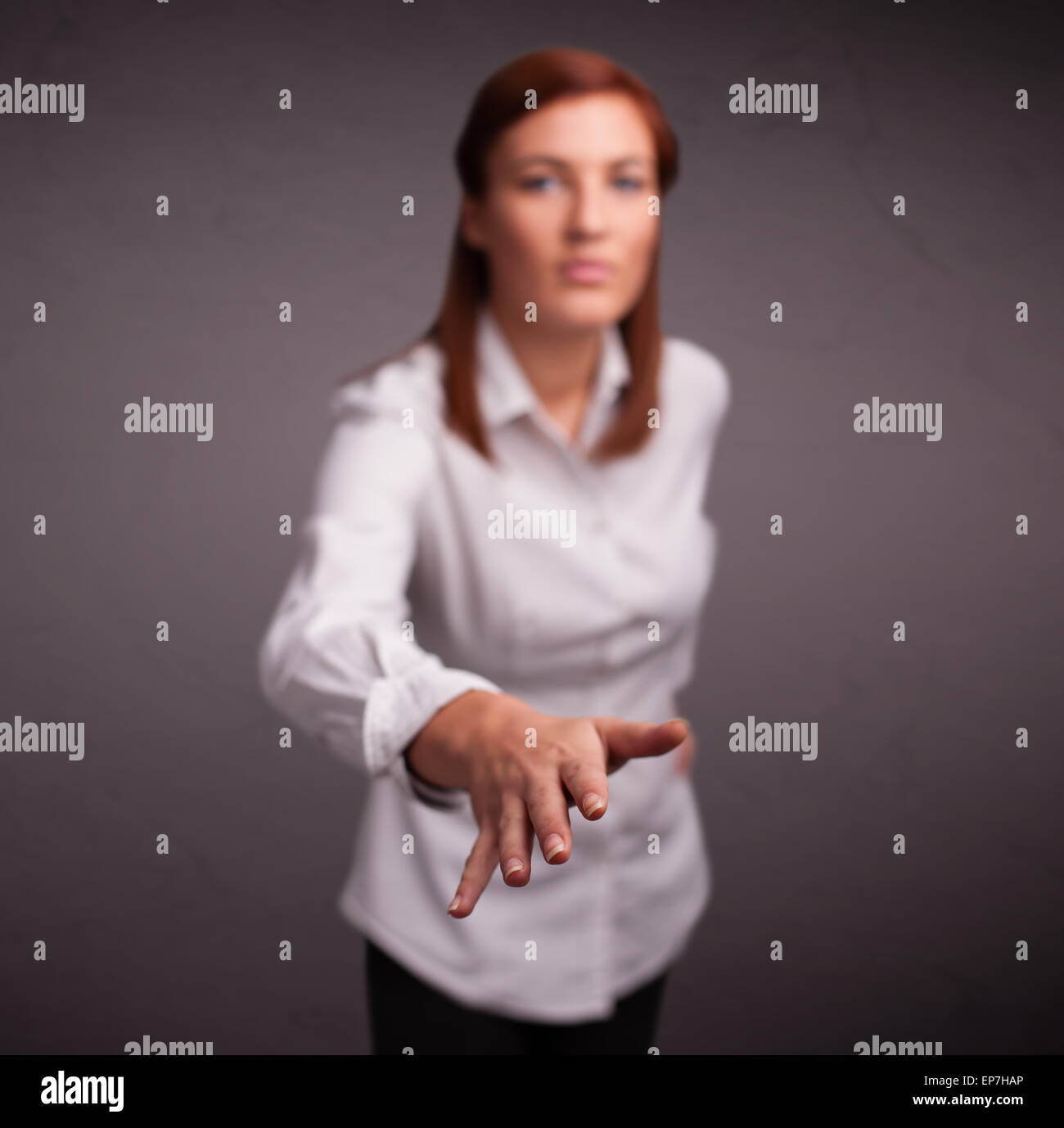 Pretty girl holding something Stock Photo - Alamy