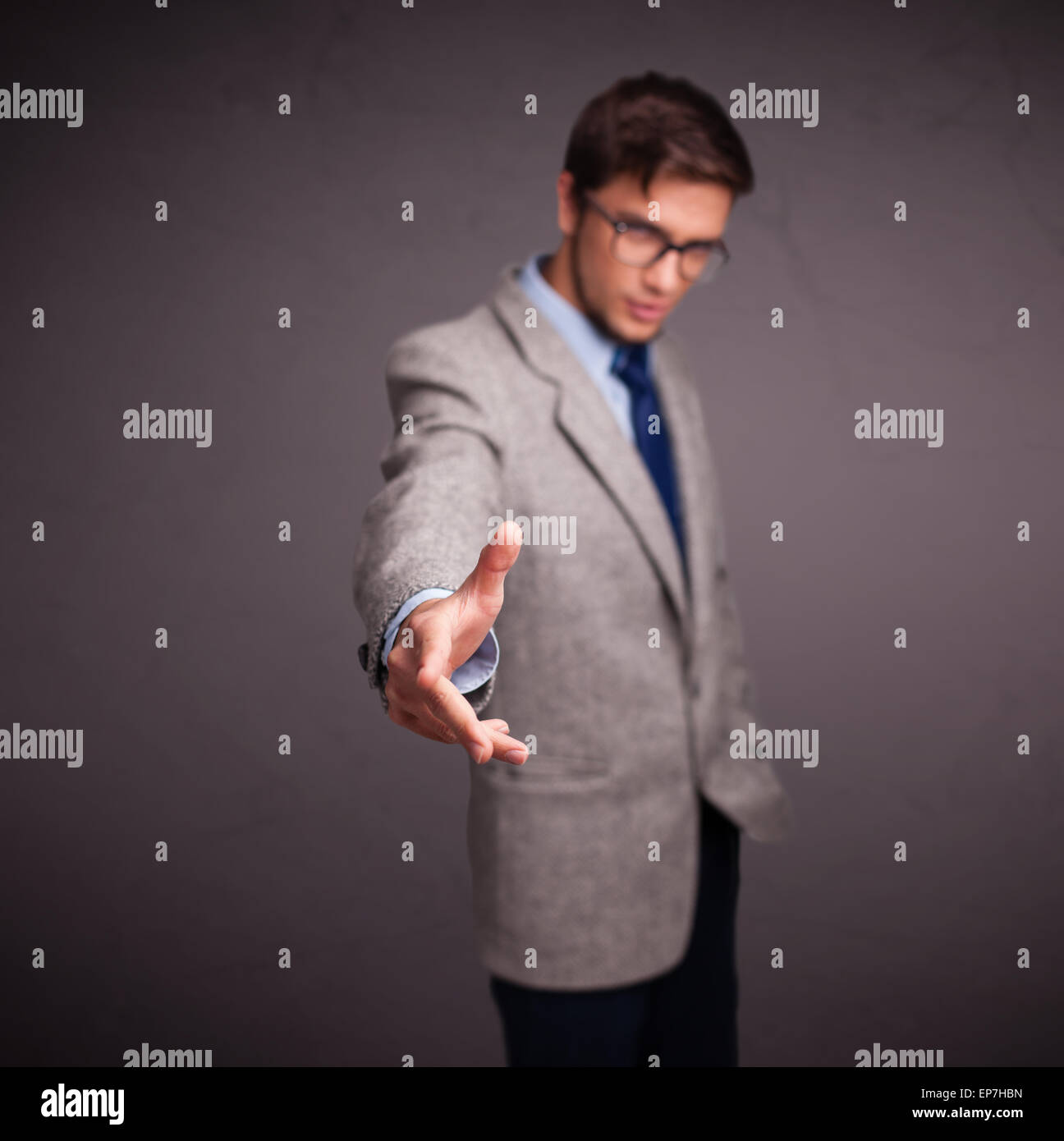 Young man standing and throwing something Stock Photo - Alamy