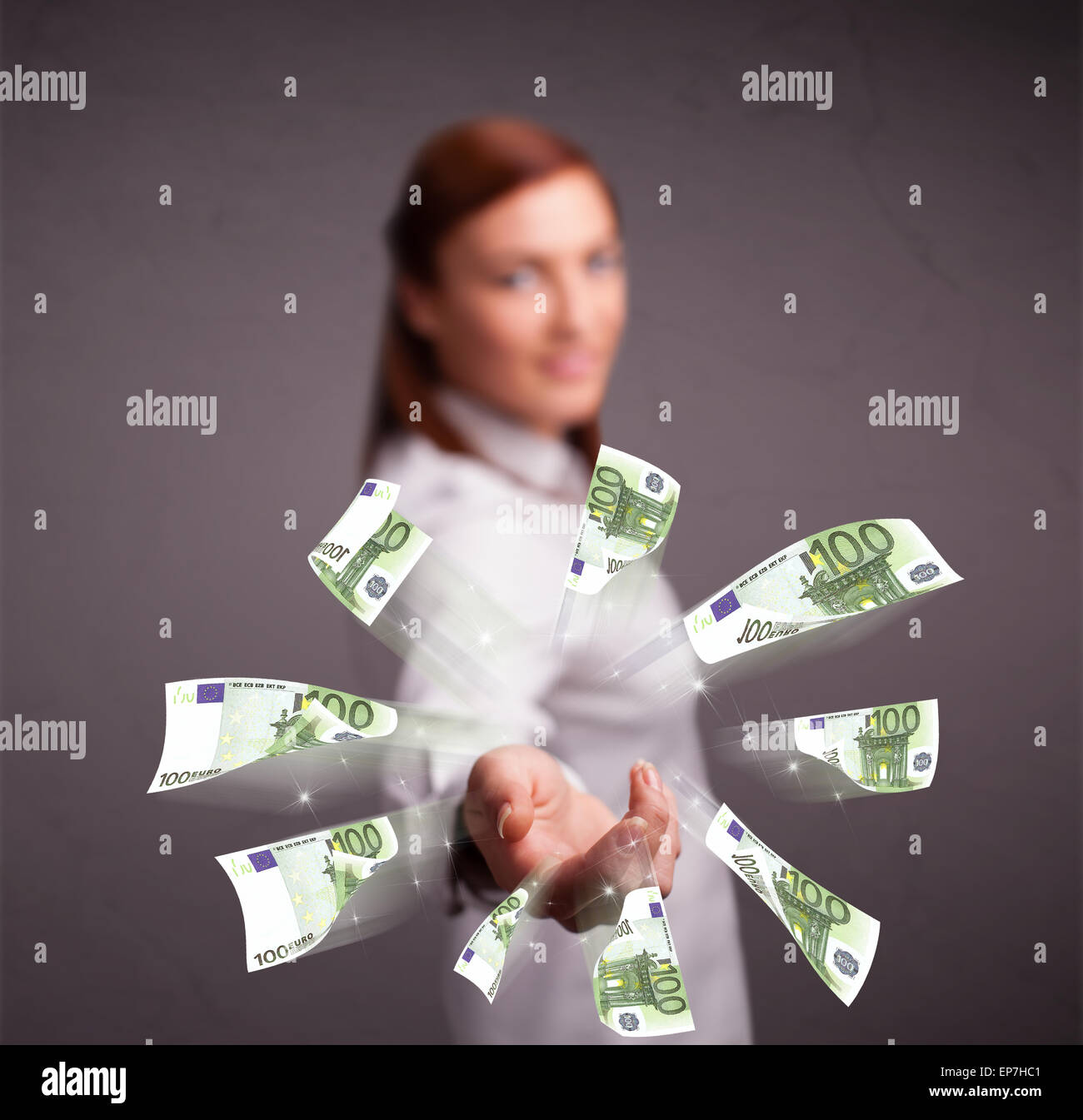 Pretty woman standing and throwing money Stock Photo - Alamy