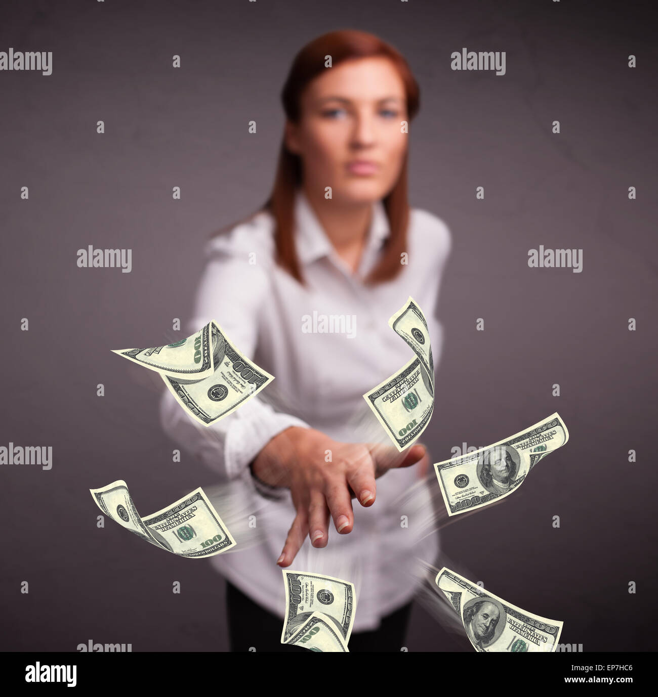 Young girl throwing money Stock Photo - Alamy
