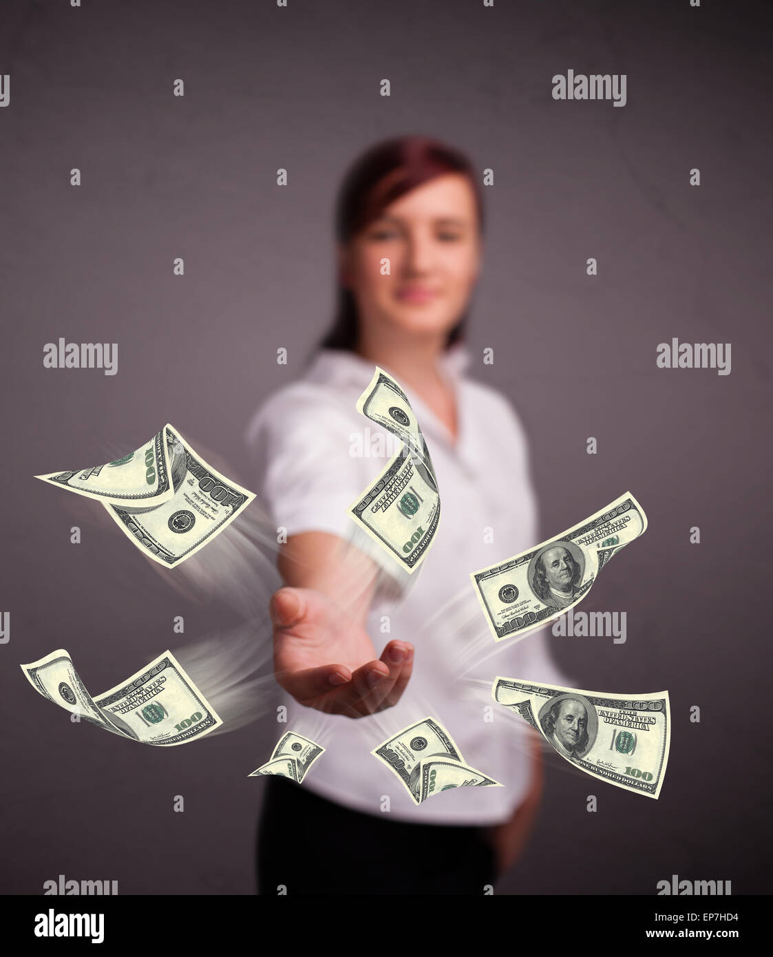 Young girl throwing money Stock Photo - Alamy
