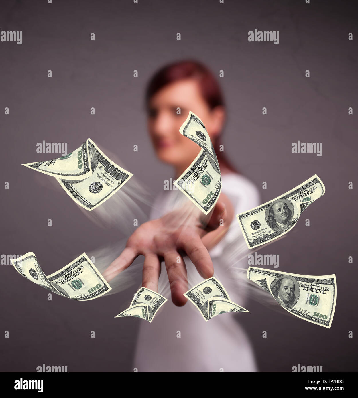 Young girl throwing money Stock Photo - Alamy