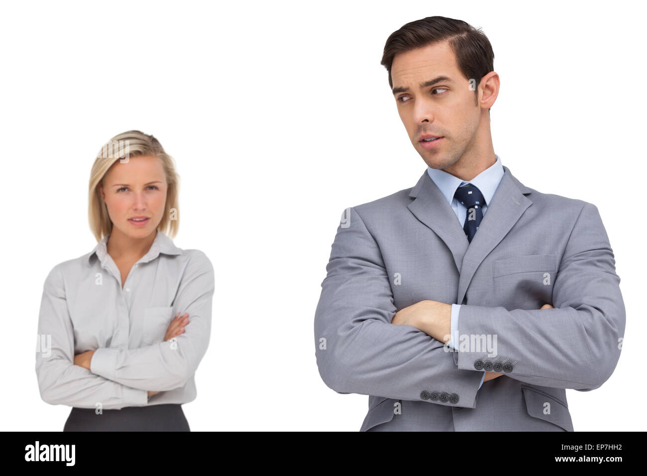Business people standing together showing rivalry Stock Photo - Alamy