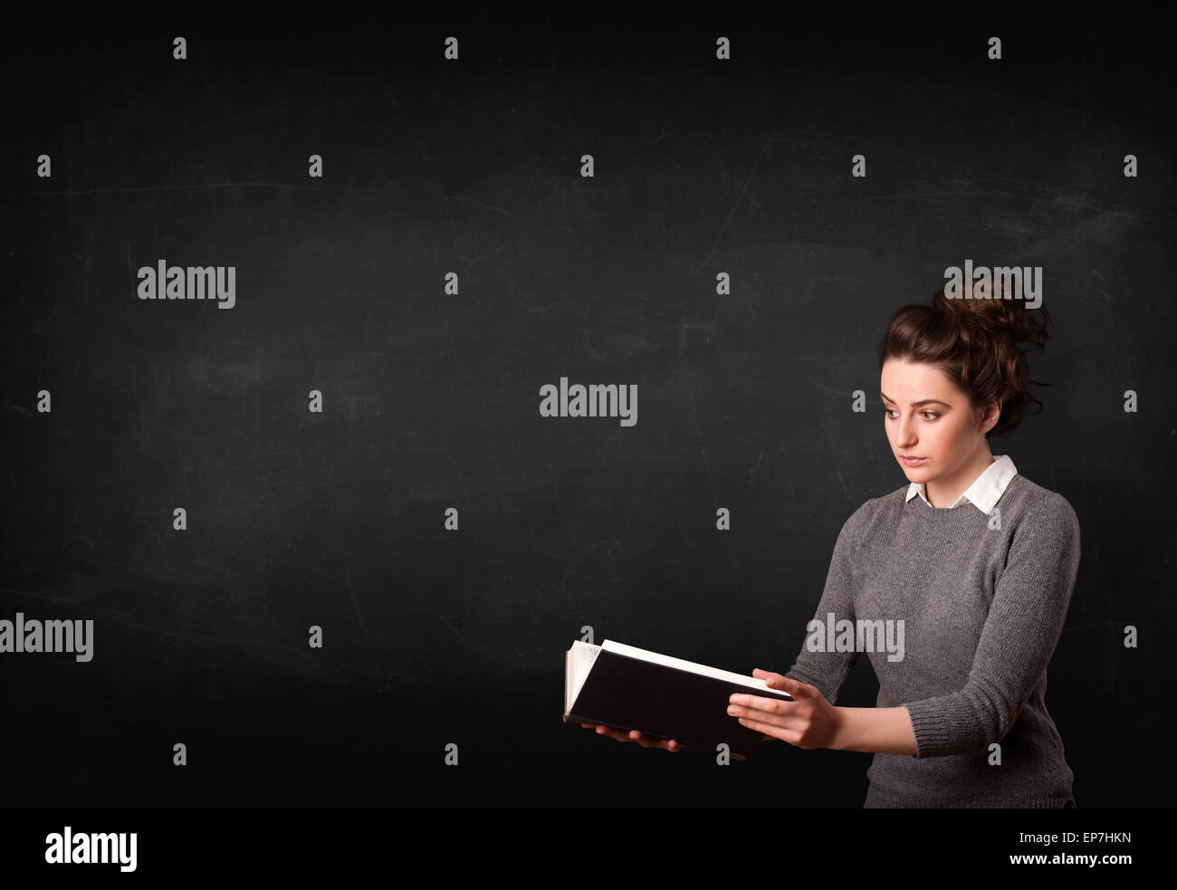 Young lady reading a book Stock Photo - Alamy
