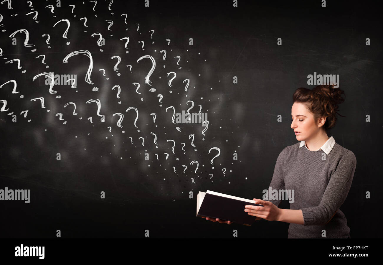Pretty woman reading a book with question marks coming out from it ...