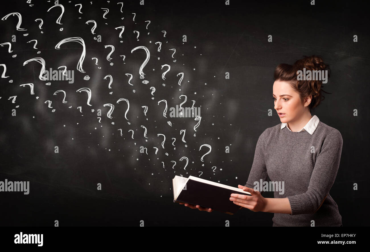 Pretty woman reading a book with question marks coming out from it ...