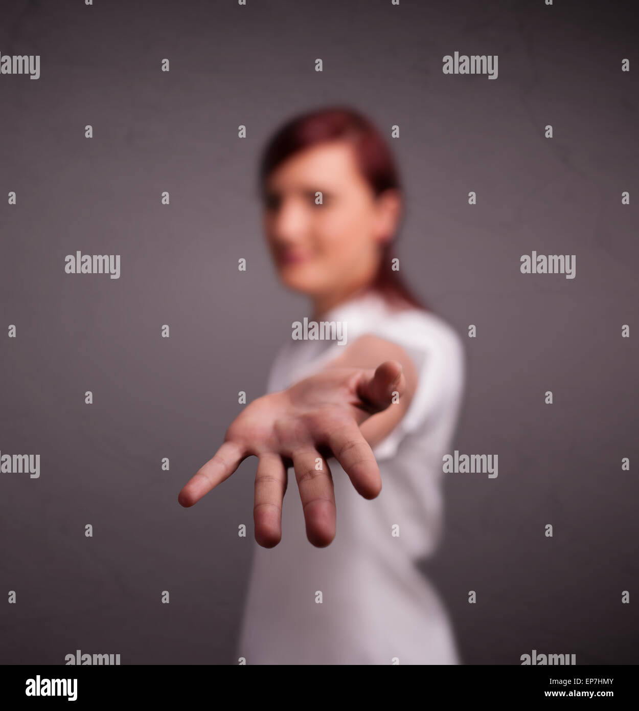Pretty girl holding something Stock Photo - Alamy
