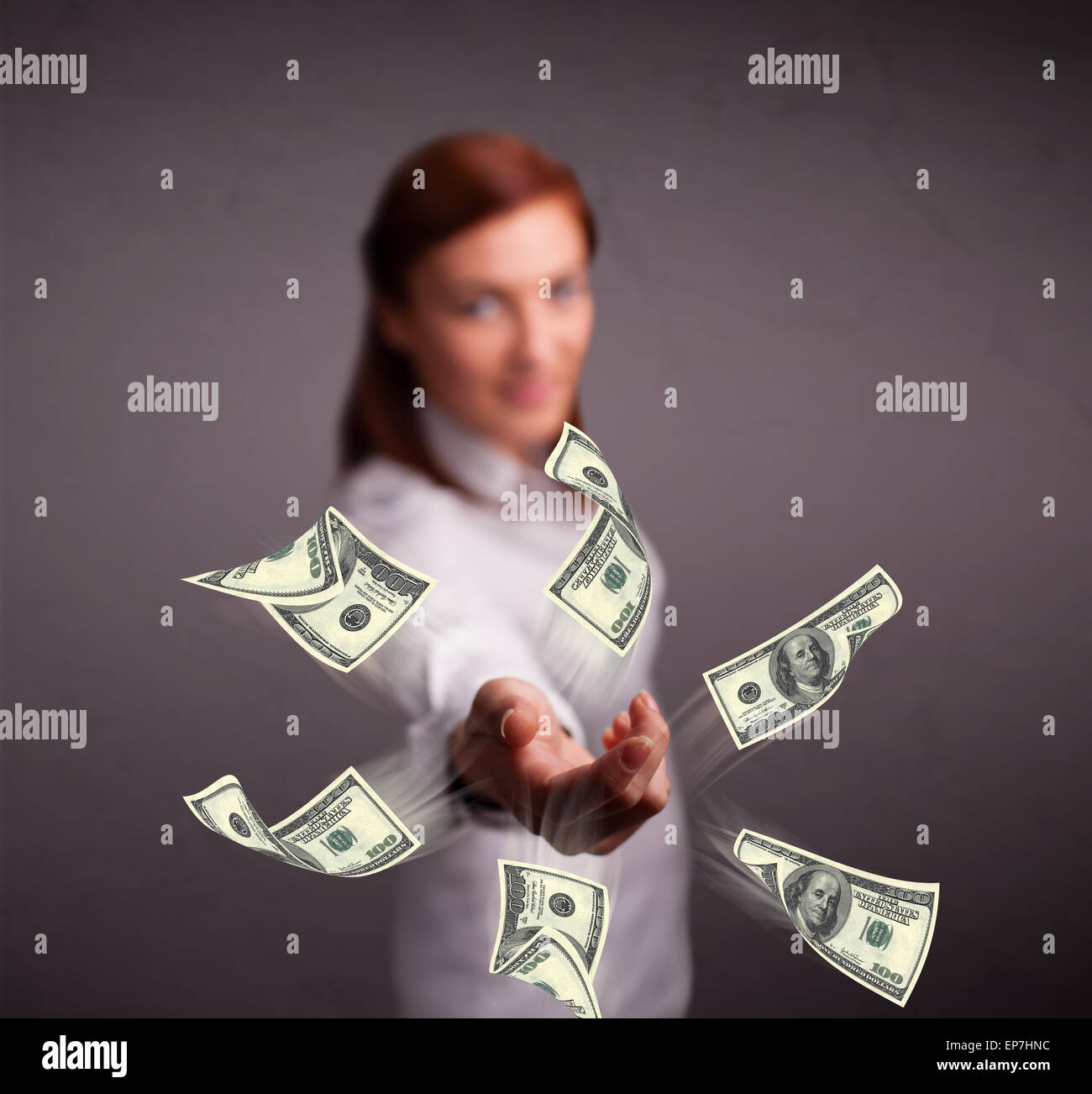 Young girl throwing money Stock Photo - Alamy