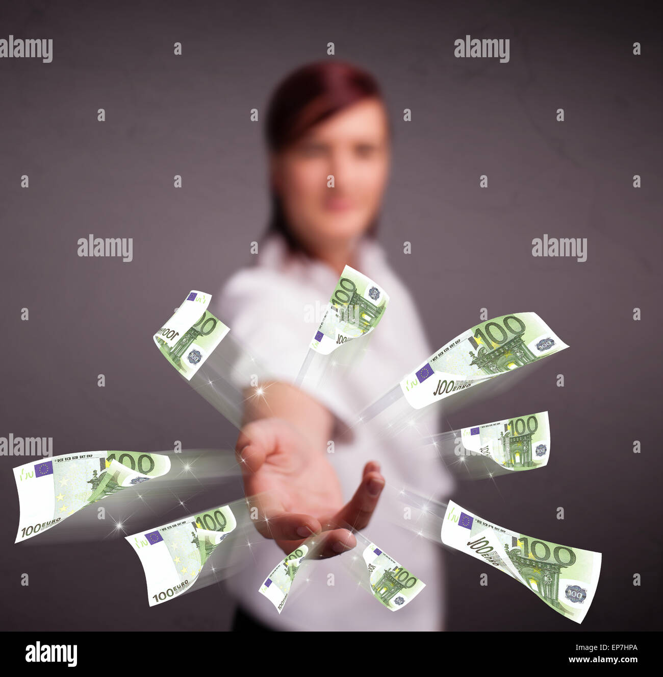 Pretty woman standing and throwing money Stock Photo - Alamy