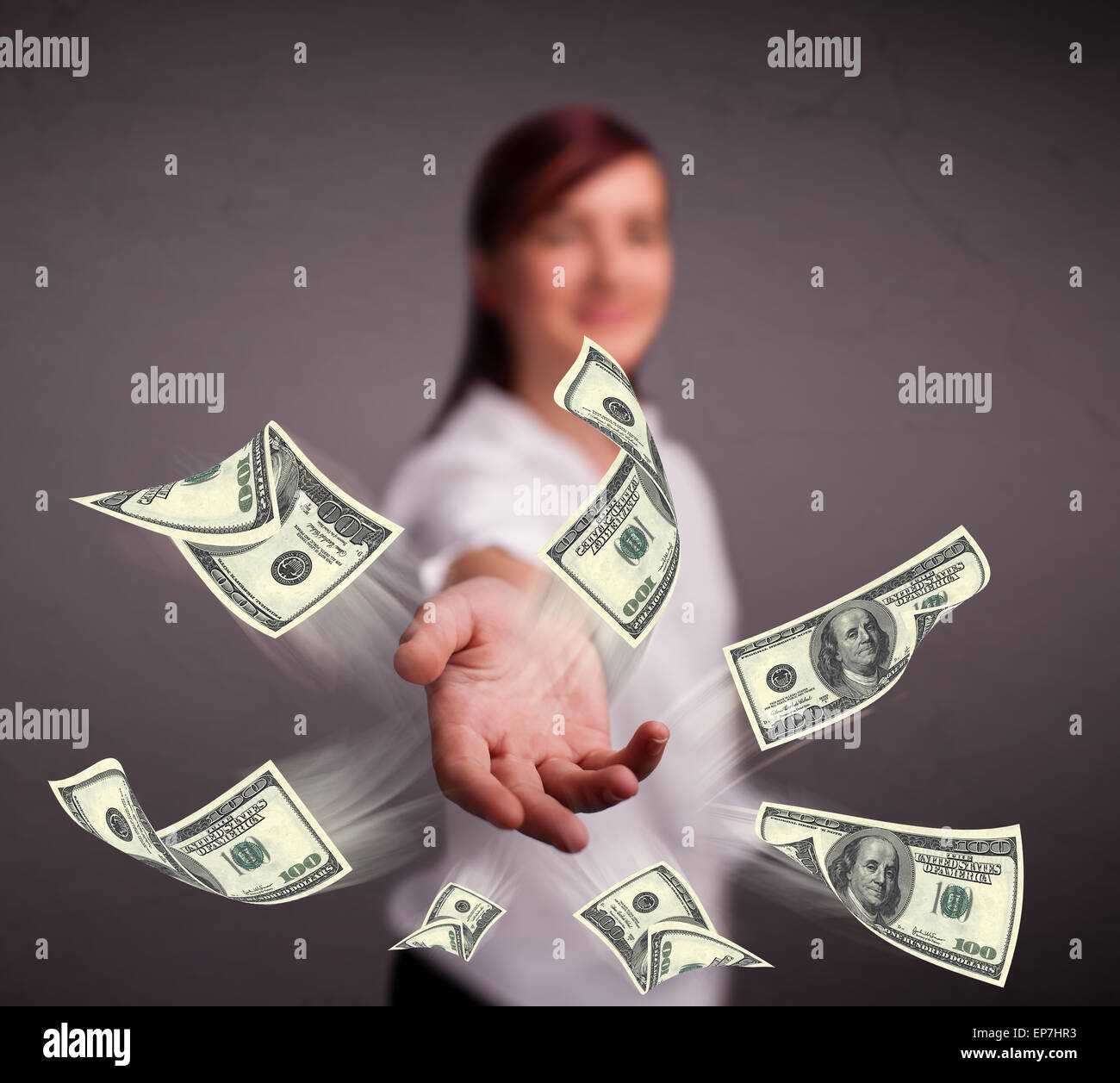 Young girl throwing money Stock Photo - Alamy