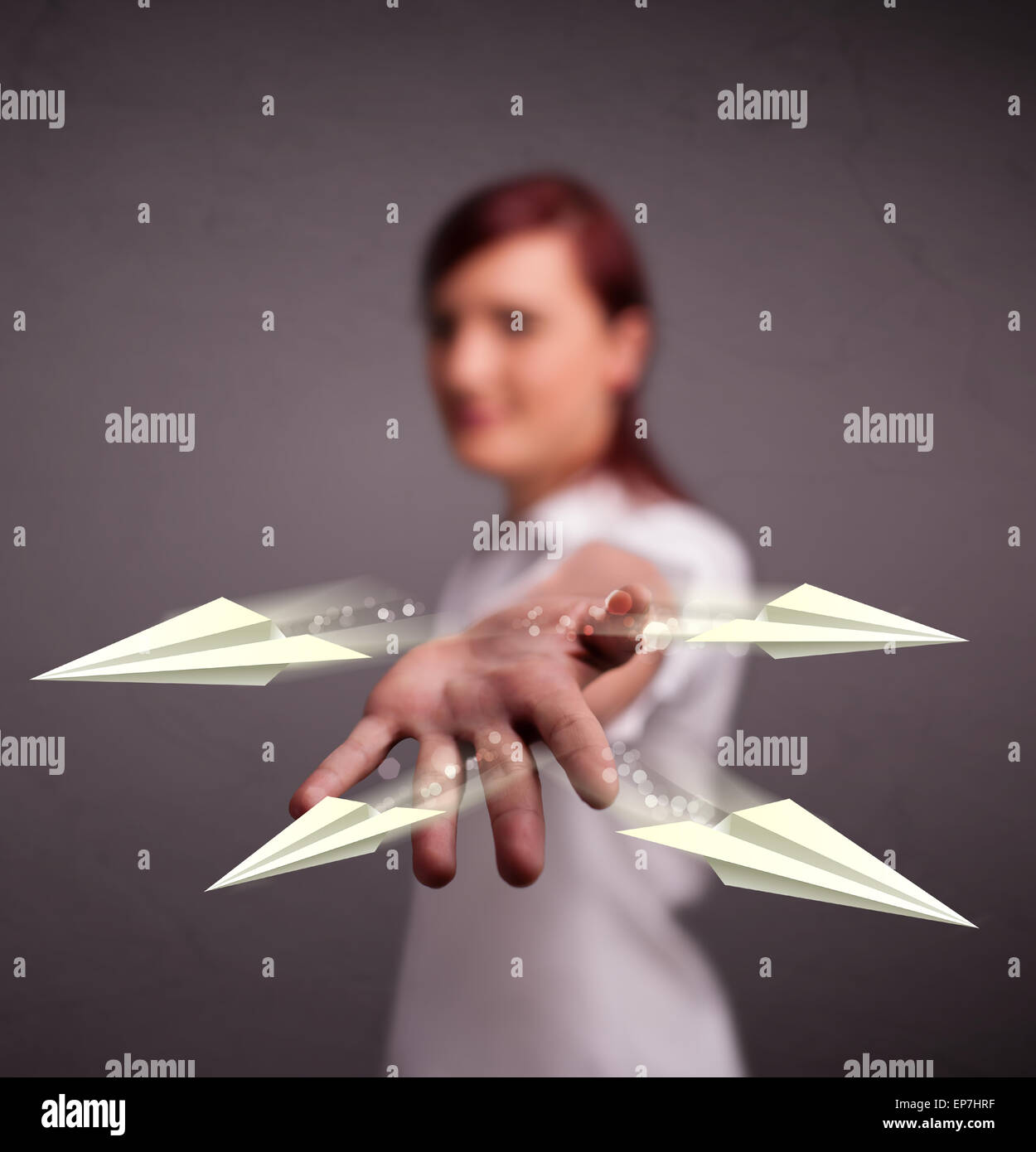 Beautiful lady throwing origami airplanes Stock Photo - Alamy