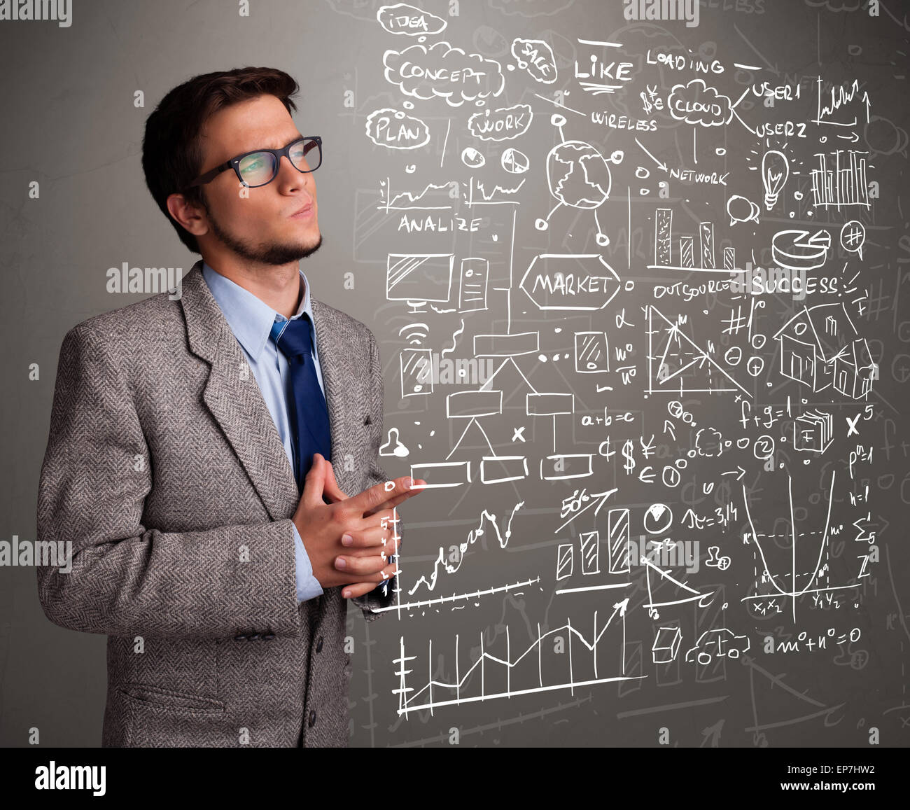 Attractive man looking at stock market graphs and symbols Stock Photo ...