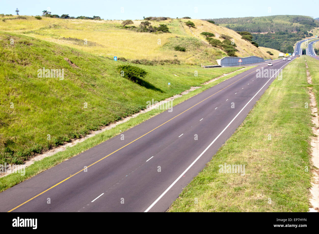 double lane highway disappearing into the distance Stock Photo - Alamy
